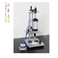 China Vertical pneumatic automatic perfume lotion Essence eye drops cooling oil bottle capping stainless steel capping machine for sale