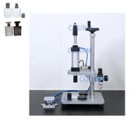 China Vertical pneumatic automatic perfume lotion Essence eye drops cooling oil bottle capping stainless steel capping machine for sale