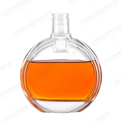 China 350ml 500ml 700ml Round Glass Liquor Decanter with Hot Stamping and Engraved Glass Lid for sale