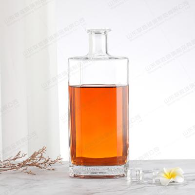 China Customized 750ml End XO Transparent Glass Wine Bottle with Rubber Stopper Sealing Type for sale