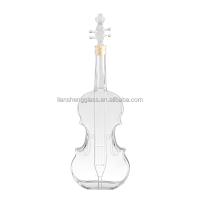 China 350ml 500ml 750ml 1000ml Guitar Shape Glass Bottles With Gold Lid For Whiskey Liquor for sale