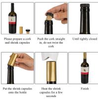China OEM ODM Custom Wine Bottle Cork With Black Plastic Top Gold PVC Shrink Capsule for sale
