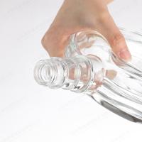 China Customized Color 500ml 700ml 750ml Flat Round Glass Bottle for Beverage Packaging for sale