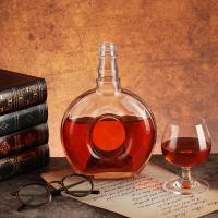China Customized Color 500ml 700ml 750ml Flat Round Glass Bottle for Beverage Packaging for sale