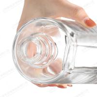 China Customized Xo Transparent Glass Bottle 500ml 750ml Whisky Gin Bottle With Cork Stopper for sale