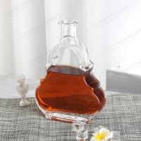 China 1L Creative Glass Bottle for Alcoholic Beverages Glass Lid Custom Label Transparent for sale
