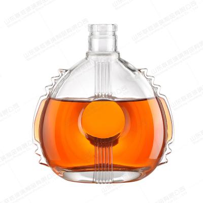 China Custom Transparent Round Empty Vodka Brandy Gin Rum Liquor Spirit Glass Bottle With Screw Cap Cork for sale