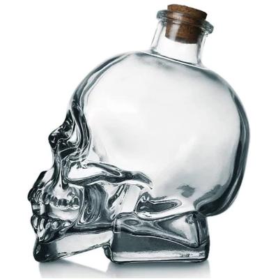 China Customized Lead-free Glass Skull Prop Whisky Bottle with Cork 700ml and Customized Logo for sale