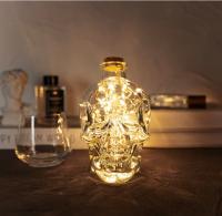 China Customized Lead-free Glass Skull Prop Whisky Bottle with Cork 700ml and Customized Logo for sale