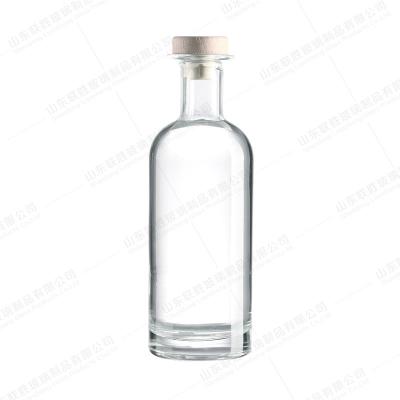 China Rubber Stopper Sealing Type Custom Logo Clear Glass Bottle for Whiskey Vodka Rum Gin T Tap for sale