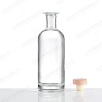 China Rubber Stopper Sealing Type Custom Logo Clear Glass Bottle for Whiskey Vodka Rum Gin T Tap for sale