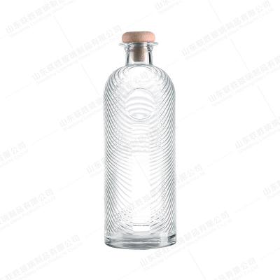 China Exquisite Carved Exterior Glass Bottle with Customizable Logo and Transparent Design for sale