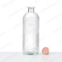 China Exquisite Carved Exterior Glass Bottle with Customizable Logo and Transparent Design for sale