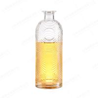 China Exquisite Carved Exterior Glass Bottle with Customizable Logo and Transparent Design for sale