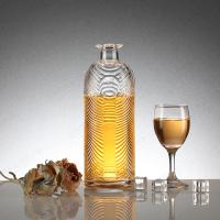 China Exquisite Carved Exterior Glass Bottle with Customizable Logo and Transparent Design for sale