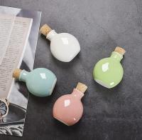 China Custom Size Accepted Industrial Cosmetic Square and Round Perfume Glass Bottle with Lids for sale