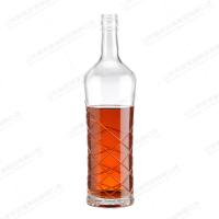 China 500ml 700ml 750ml Round Engraved Glass Bottle with Screw Cap for Vodka Gin Whisky for sale