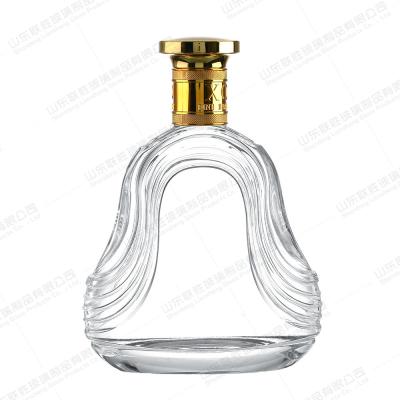 China Custom Transparent Round Empty Glass Liquor Wine Vodka Tequila Whisky Bottle With Lid for sale
