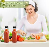 China 750ml Round Olive Oil Glass Bottle with Customized Black Screw Cap and Transparent for sale