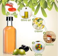 China 750ml Round Olive Oil Glass Bottle with Customized Black Screw Cap and Transparent for sale