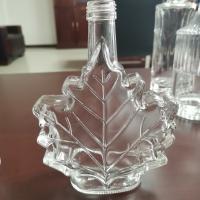 China High Borosilicate 25cl Leaf Shape Spirit Glass Bottle With Screw Cap for sale