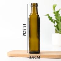 China Glass Collar Clear 500ml 750ml Dark Green Round Marasca Cooking Oil Bottle With Lid for sale