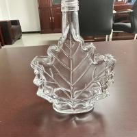 China High Borosilicate 25cl Leaf Shape Spirit Glass Bottle With Screw Cap for sale