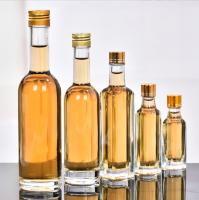 China Glass Olive Oil Bottle 100ml 250ml 500ml Round Clear Cooking Oil Bottle with Cap for sale