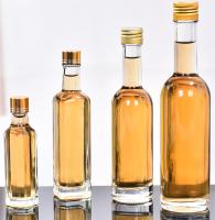 China Glass Olive Oil Bottle 100ml 250ml 500ml Round Clear Cooking Oil Bottle with Cap for sale