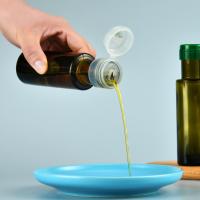 China Industrial Green Brown Round Olive Oil Glass Bottles with Rubber Stopper Sealing Type for sale