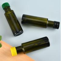 China Industrial Green Brown Round Olive Oil Glass Bottles with Rubber Stopper Sealing Type for sale