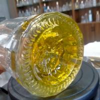 China Gradient Yellow 750ml Round Glass Bottle For Whiskey Gin Tequila Lock Cap for sale