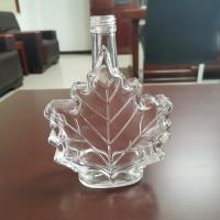 China Glass Collar 50ml Empty Maple Leaf Shaped Crew Top Glass Bottle 100ml Mini Glass Bottle for sale
