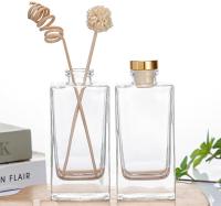 China Industrial Beverage 50ml Flat Square Glass Diffuser Bottle with Rattan Dried Flower for sale