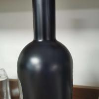 China Custom 250ml 500ml 700ml 750ml Matte Black Color Round Long Neck Spirit Glass Bottle for sale