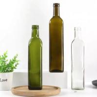 China Green Glass Round Olive Oil Bottle With Lid Olive Oil Bottle with Logo Customization for sale