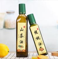 China Green Glass Round Olive Oil Bottle With Lid Olive Oil Bottle with Logo Customization for sale