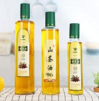 China Green Glass Round Olive Oil Bottle With Lid Olive Oil Bottle with Logo Customization for sale