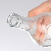 China 350ml 500ml 750ml Empty Round Bottom Vodka Liquor Whiskey Glass Bottle With Lid for sale