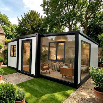 China Expandable Container House With White Panel And Black Frame And Wooden Color Floor Tiny House for sale