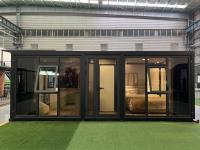 China 10ft Expandable Container House Luxury Folding Villa 20m² with Wood Grain Metal Cladding for sale