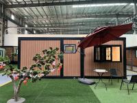 China 10ft Expandable Container House Luxury Folding Villa 20m² with Wood Grain Metal Cladding for sale