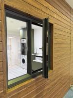 China 20ft Flat Pack Container House 3x6m Eco Walnut Wood Grain ADU Luxury Prefab Granny Flat for sale