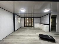 China 30FT Suburban Estate Expandable Container House – Textured White Block Edition for sale