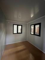 China 20ft Expandable Container House with Grey Cladding, White Frame and Glass Sliding Doors for sale
