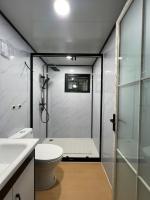 China 20ft Expandable Container House with Grey Cladding, White Frame and Glass Sliding Doors for sale