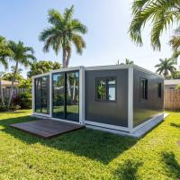 China 20ft Expandable Container House with Grey Cladding, White Frame and Glass Sliding Doors for sale