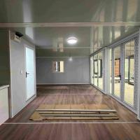 China 20ft Expandable Container House with Wood-Grain Cladding and Full-Height Glazing for sale