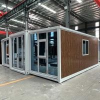 China 20ft Expandable Container House with Wood-Grain Cladding and Full-Height Glazing for sale