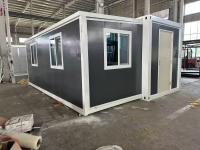 China 20ft Expandable Container House with Dark Charcoal Cladding, White Frame and Casement Windows for sale